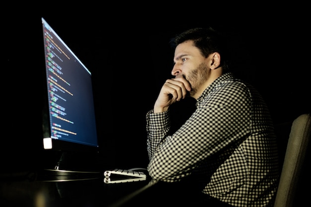 Premium Photo Software Developer Computer At Dark Home Office Startup And Hard Working Concept