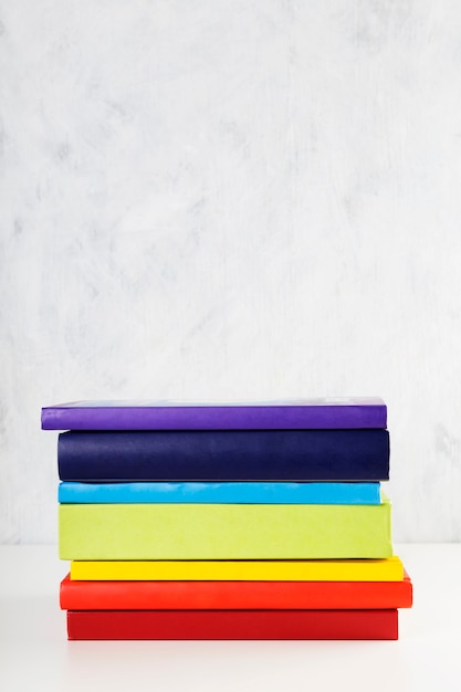 Premium Photo | Stack of colorful rainbow books Premium Photo | Stack of colorful rainbow books