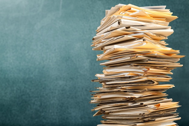 Premium Photo | Stack file folders with documents on background Premium Photo | Stack file folders with documents on background