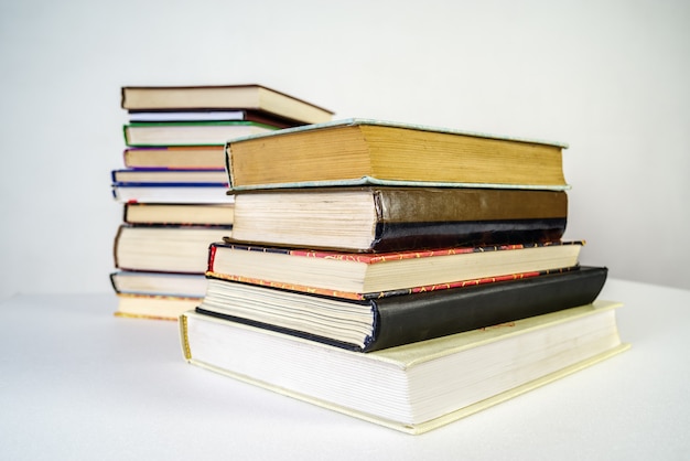 Premium Photo | Stack of old books on white background Premium Photo | Stack of old books on white background