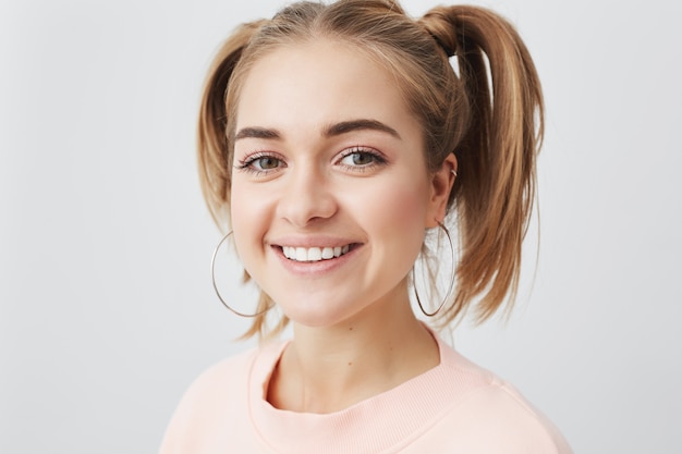 Free Photo | Stylish charming beautiful caucasian female with two ... Free Photo | Stylish charming beautiful caucasian female with two ...