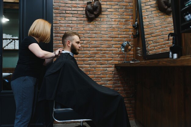 Premium Photo | Stylish man sitting barber shop hairstylist hairdresser Premium Photo | Stylish man sitting barber shop hairstylist hairdresser