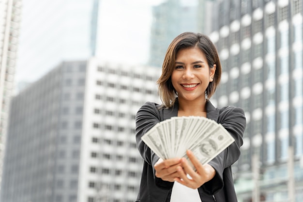 Free Photo | Successful beautiful asian business woman holding money us ... Free Photo | Successful beautiful asian business woman holding money us ...