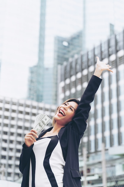 Free Photo | Successful beautiful asian business woman holding money us ... Free Photo | Successful beautiful asian business woman holding money us ...