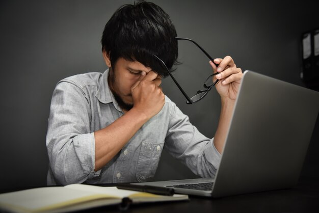 Premium Photo | Tired, exhausted asian businessman. Premium Photo | Tired, exhausted asian businessman.