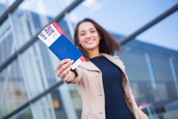 Premium Photo Travel Closeup Of Girl Holding Passports And Boarding