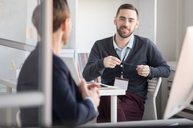 Premium Photo | Two colleagues talking in office Premium Photo | Two colleagues talking in office