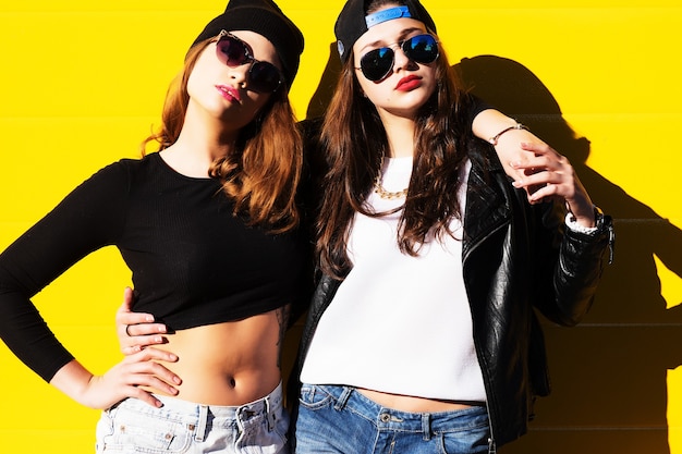 Premium Photo Two Young Girlfriends In Sunglasses Having Fun Lifestyle