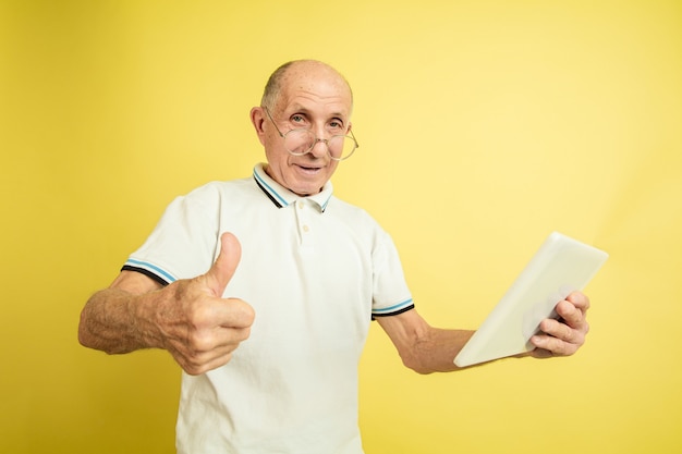 Free Photo | Using tablet, thumb up. caucasian senior man's portrait on ... Free Photo | Using tablet, thumb up. caucasian senior man's portrait on ...