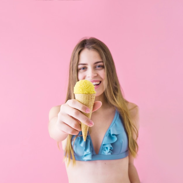 Free Photo | Woman in bikini showing ice cream Free Photo | Woman in bikini showing ice cream