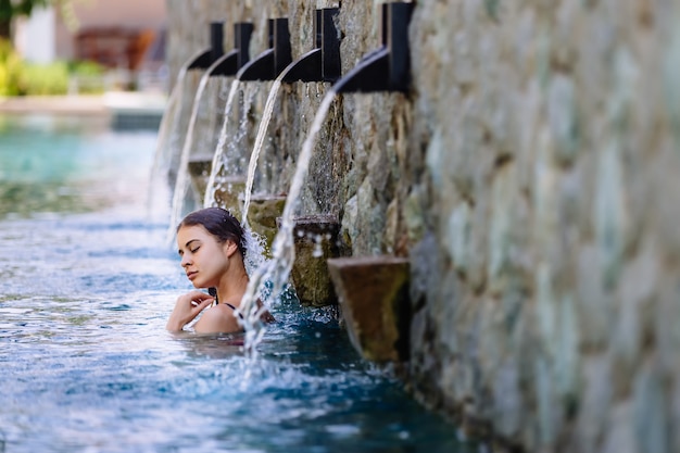 Premium Photo Woman Enjoying Vacation Holidays At Luxurious Beachfront Hotel Resort With