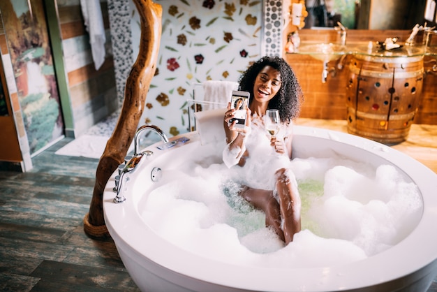 Premium Photo Woman Relaxing In The Hydro Massage Bath Covered In