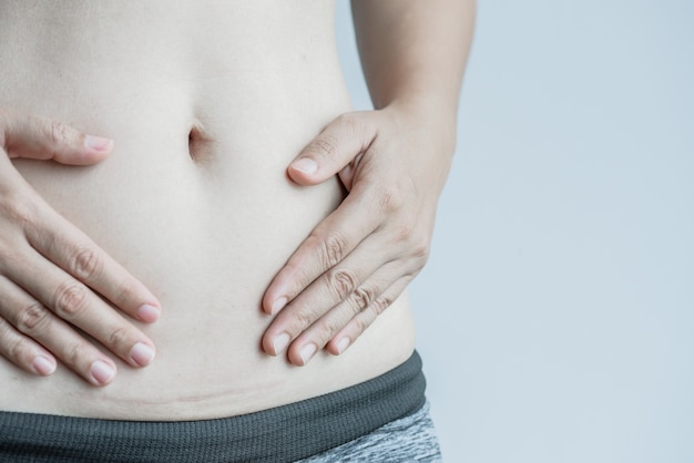 Premium Photo Woman Showing On Her Belly Dark Scar From A Cesarean