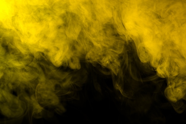 Premium Photo | Yellow smoke on a black background Premium Photo | Yellow smoke on a black background