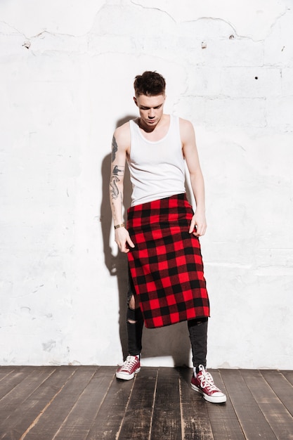 Free Photo | Young attractive man standing on floor posing Free Photo | Young attractive man standing on floor posing