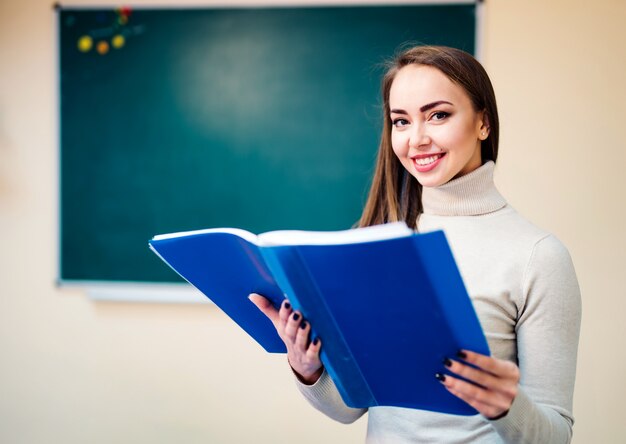 Premium Photo | Young beautiful teacher in classroom Premium Photo | Young beautiful teacher in classroom