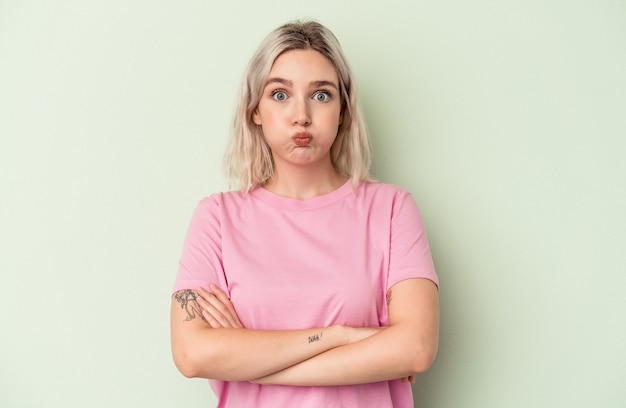 Premium Photo Young Caucasian Woman Isolated On Green Background