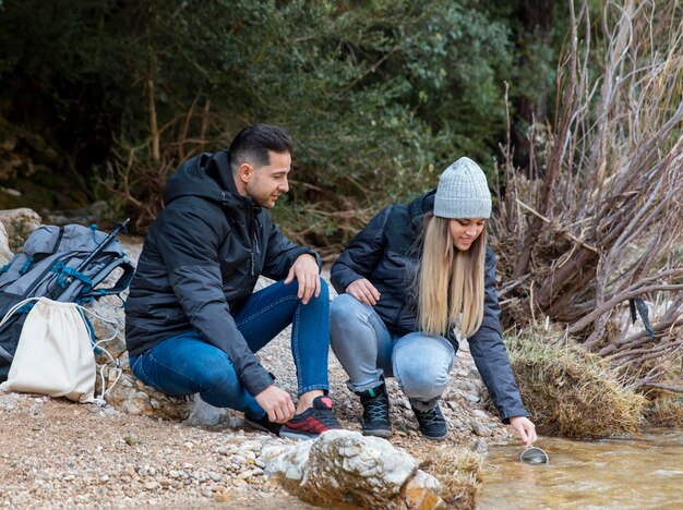 Premium Photo | Young couple exploring nature Premium Photo | Young couple exploring nature