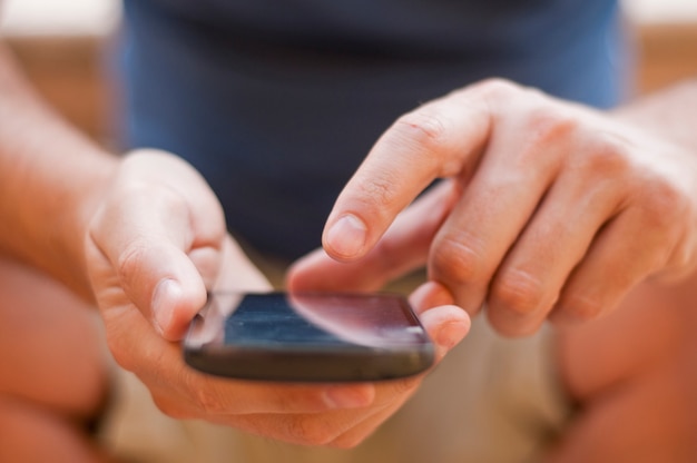 Free Photo | Young man sending text to his girlfriend Free Photo | Young man sending text to his girlfriend