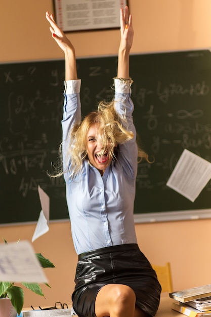 Premium Photo | Young pretty teacher screaming in the class room Premium Photo | Young pretty teacher screaming in the class room