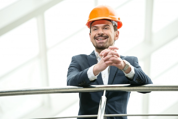 Premium Photo | Young smiling male architect in the modern office. Premium Photo | Young smiling male architect in the modern office.