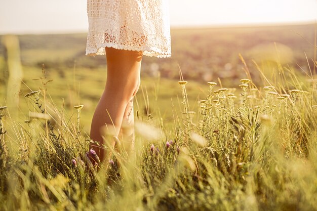 Premium Photo Young Woman In Lace Dress Standing In Green Grass