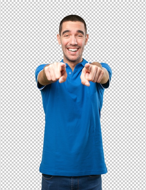 Premium PSD | Happy young man pointing Premium PSD | Happy young man pointing