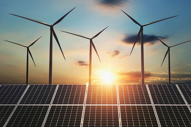 Concept énergie Propre. éolienne Et Panneau Solaire Sur Fond De Lever ... Concept énergie Propre. éolienne Et Panneau Solaire Sur Fond De Lever ...